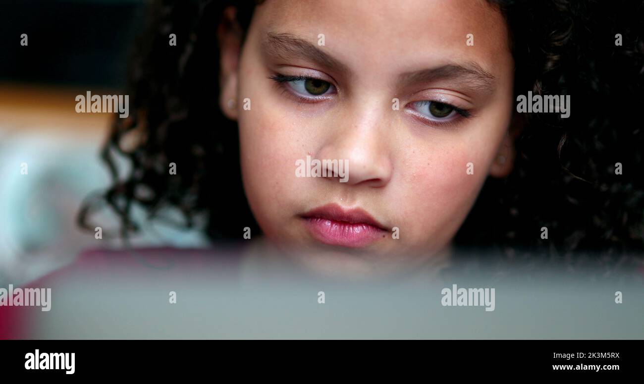 Little girl staring at computer screen, kid close-up face Stock Photo ...