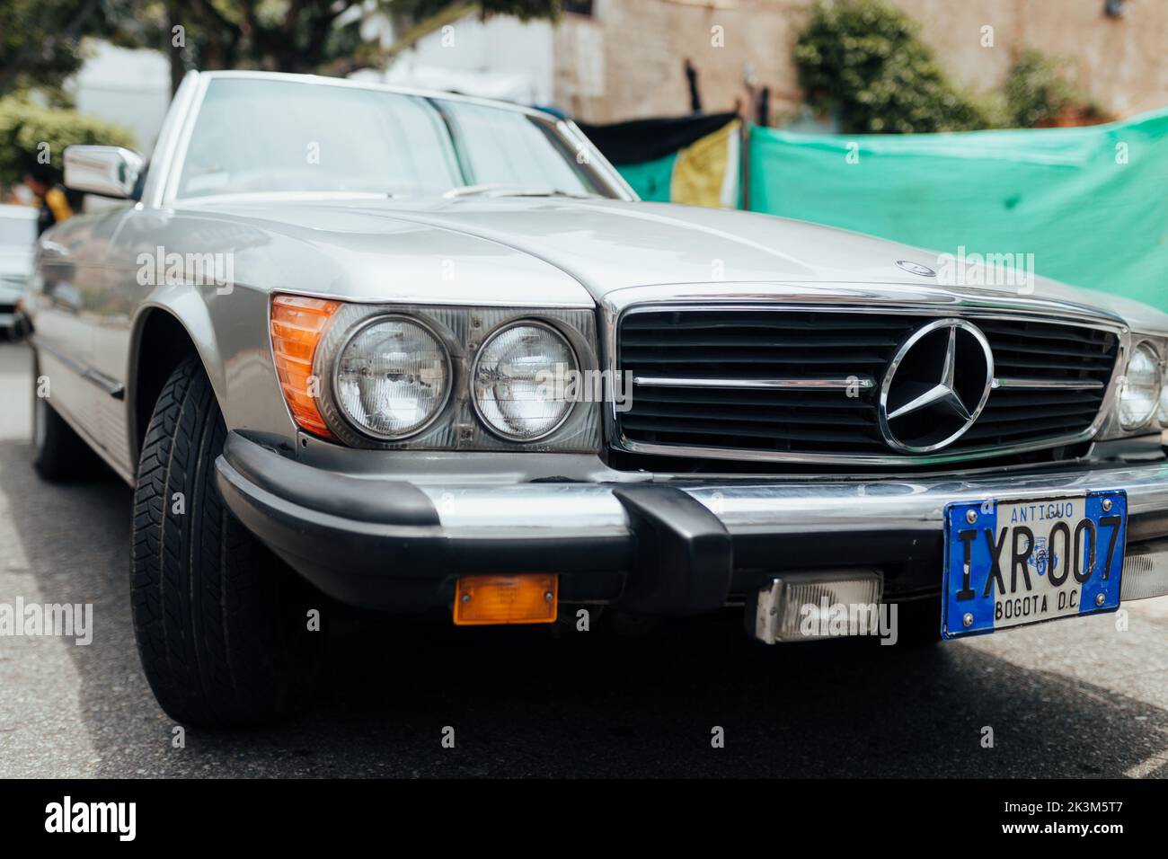 A beautiful shot of a front bumper and headlights of a vintage Mercedes ...
