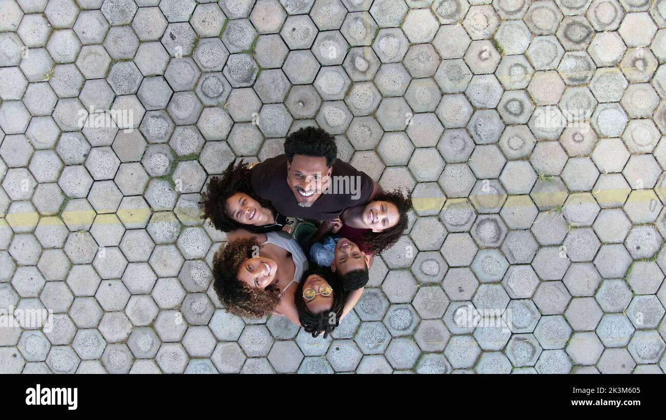 Parents and children joining hands in union and community Stock Photo ...