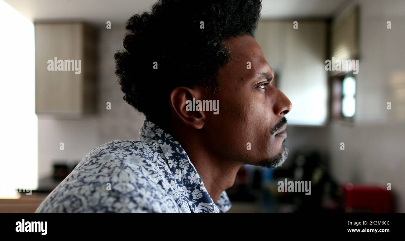 Pensive black African man thinking about solution, person closing eyes ...