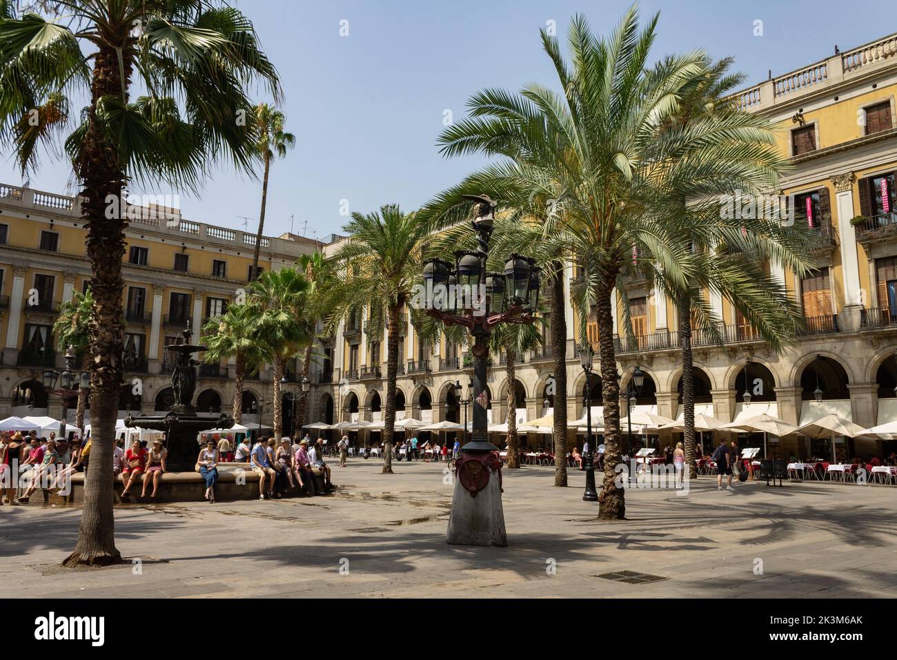 The Placa Reial square with palm trees in La Rambla, Barcelona ...