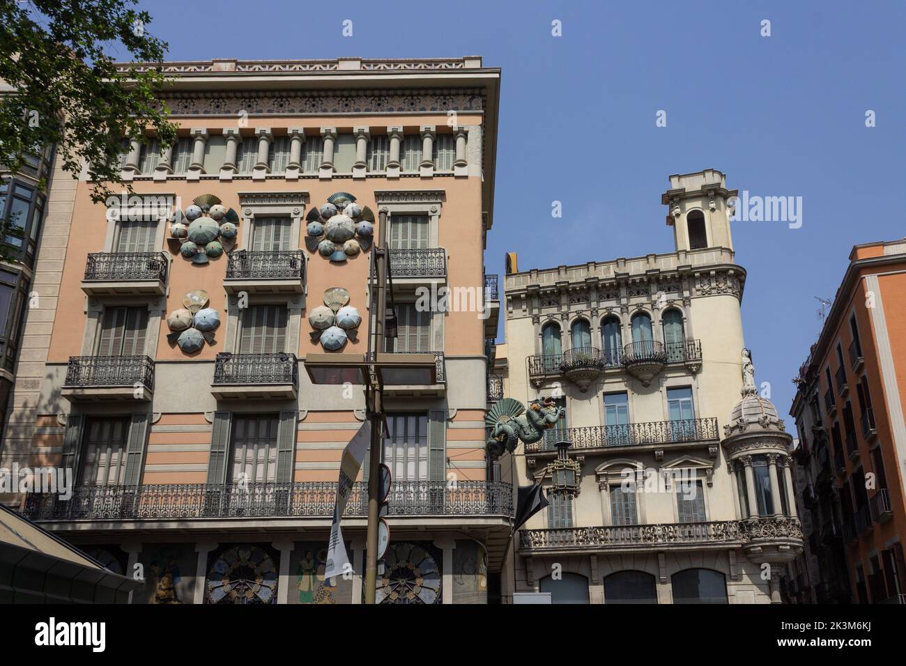 The historical building facades in famous La Rambla busy street in ...
