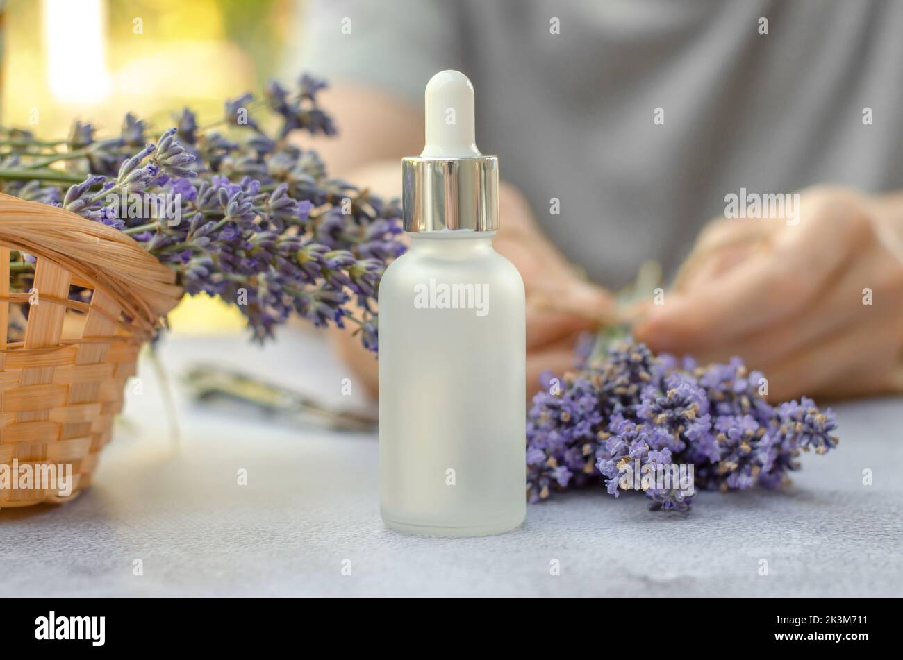 White frosted lavender oil bottle and fresh lavender flowers Stock ...