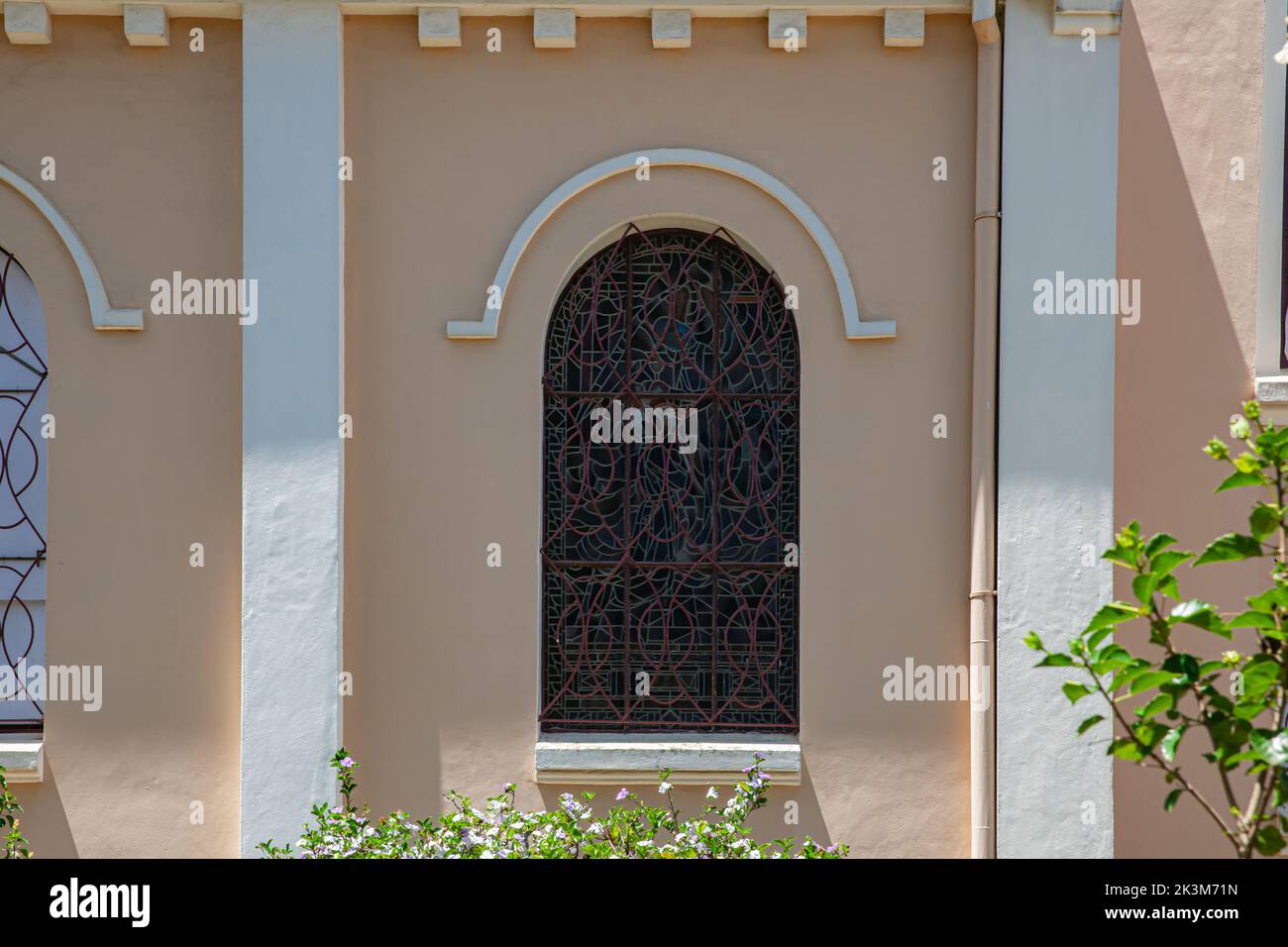 Antique vietnamese window with decoration pattern on beige paint wall ...