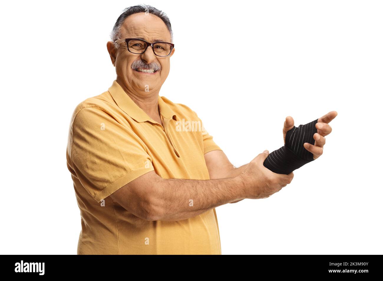 Mature man wearing an elastic wrist bandage isolated on white ...
