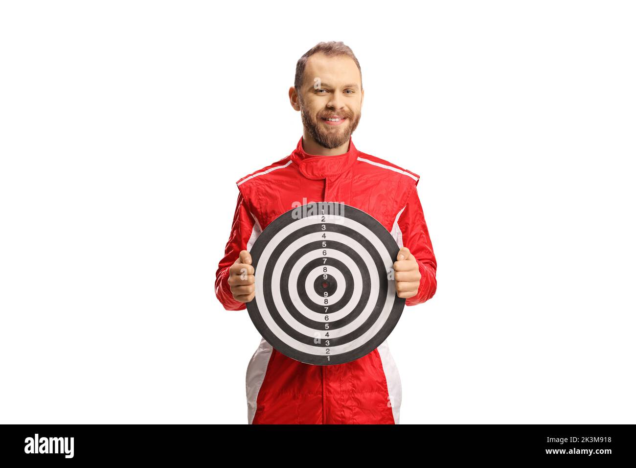 Car racer in a red suit holding a dart target board isolated on white ...
