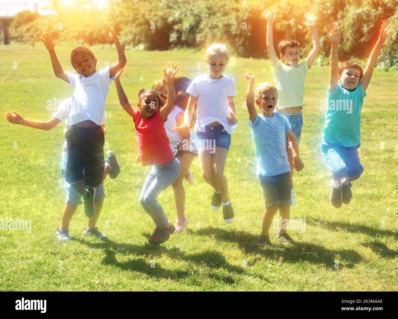 Excited children jumping hi-res stock photography and images - Alamy