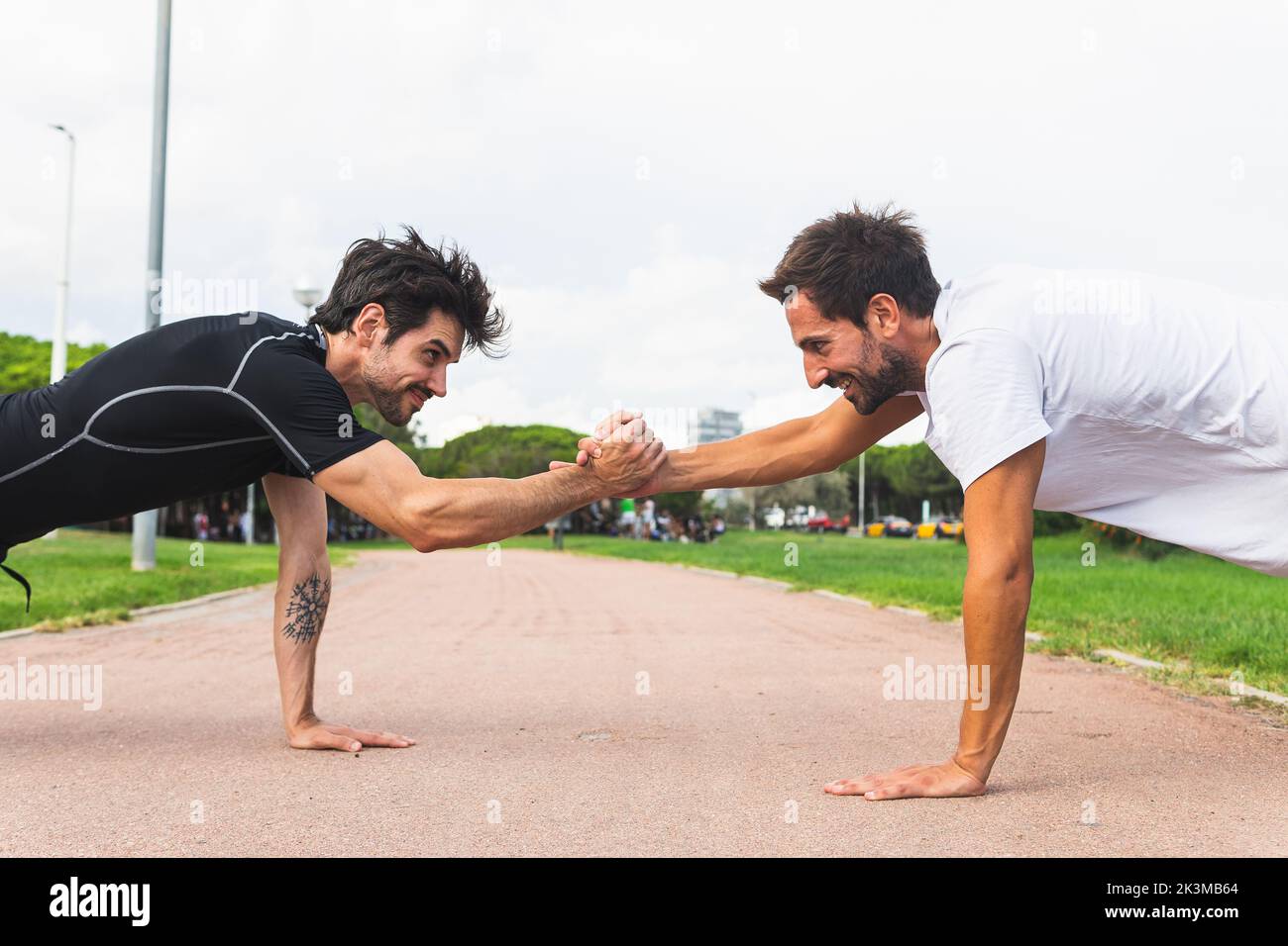 Clasping each other hi-res stock photography and images - Alamy