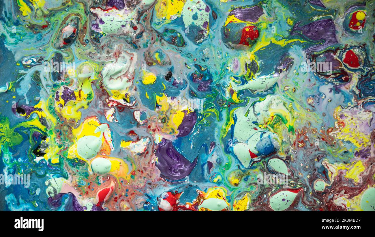 Texture created with paint of vibrant and diverse colors that create an ...