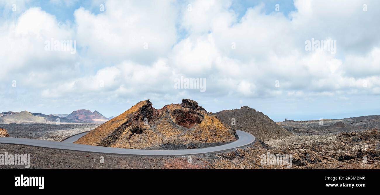 Picturesque panoramic view of curvy asphalt road going around uneven ...