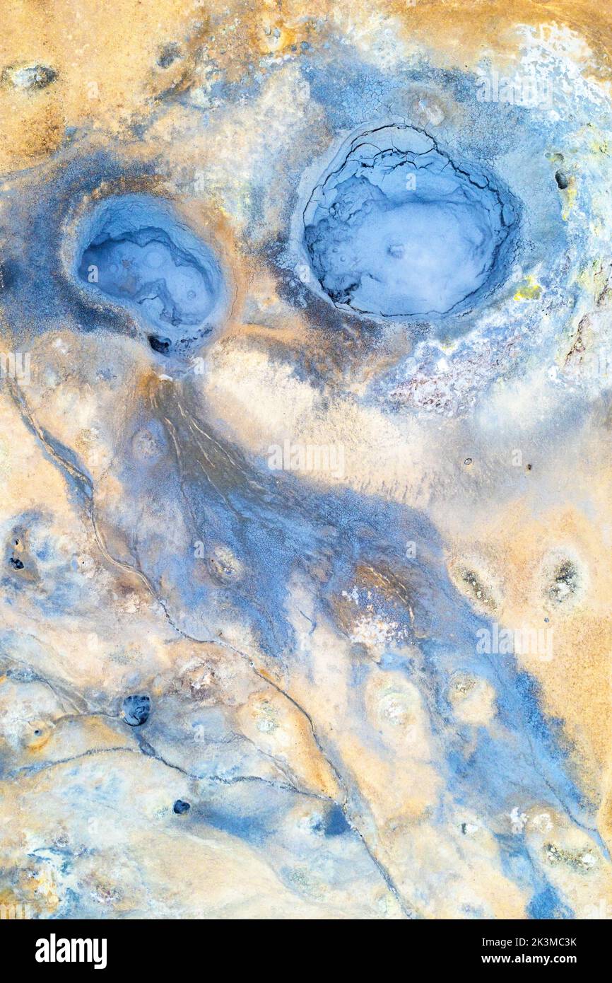 Aerial top view of blue mud bubbling in rough crater in Hverir ...
