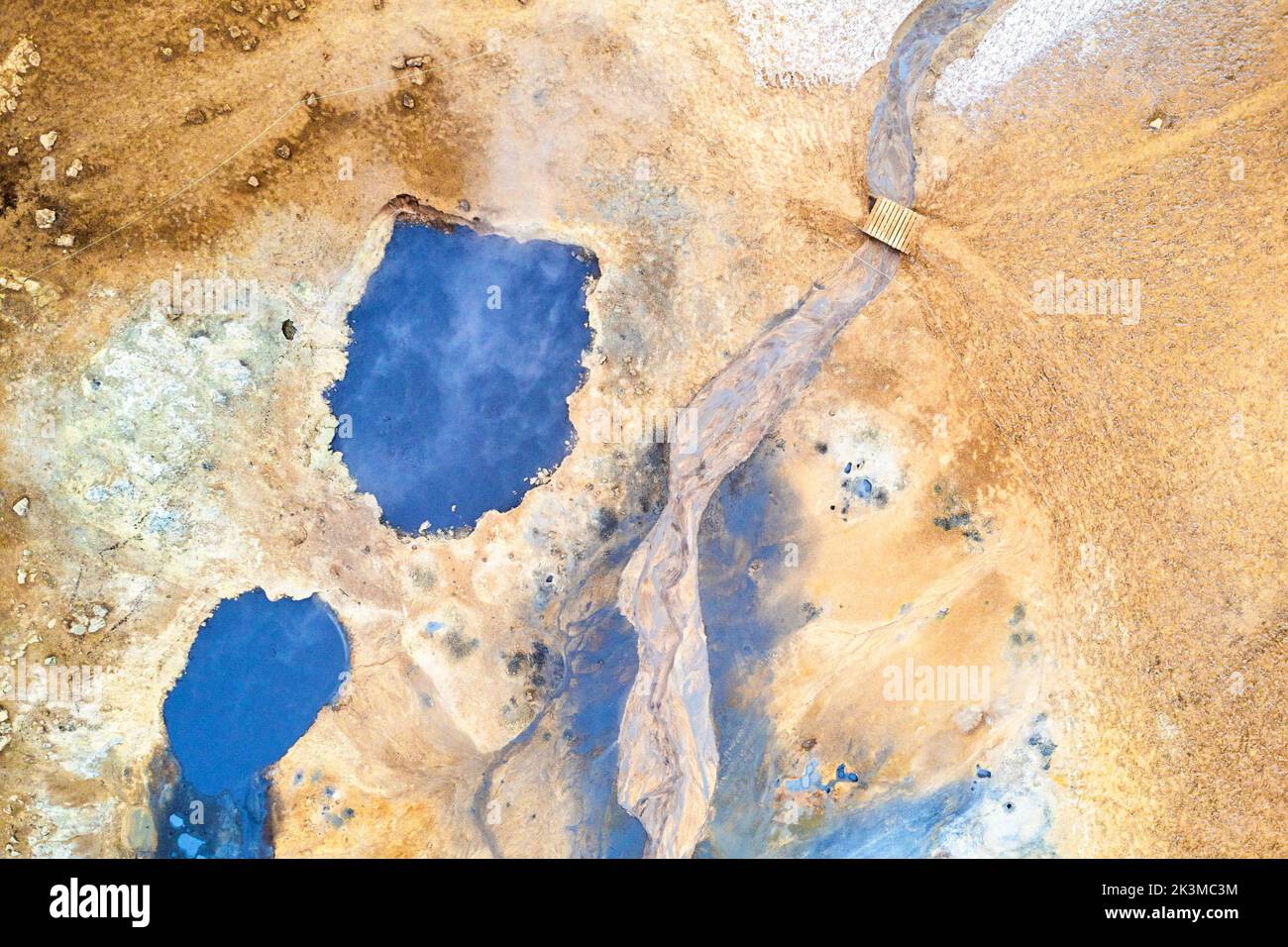 Aerial top view of blue mud in rough crater in Hverir geothermal area ...