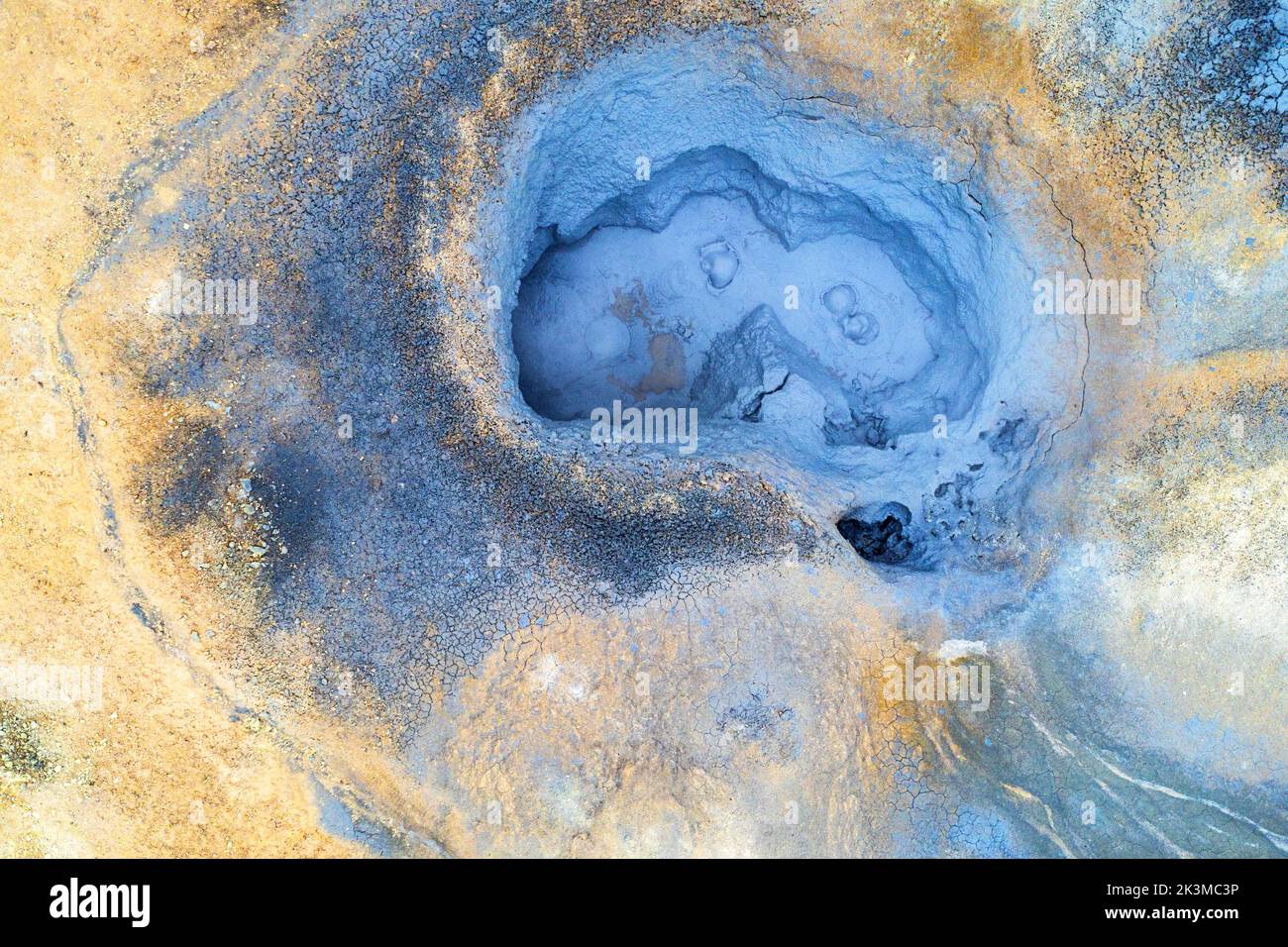 Aerial top view of blue mud bubbling in rough crater in Hverir ...