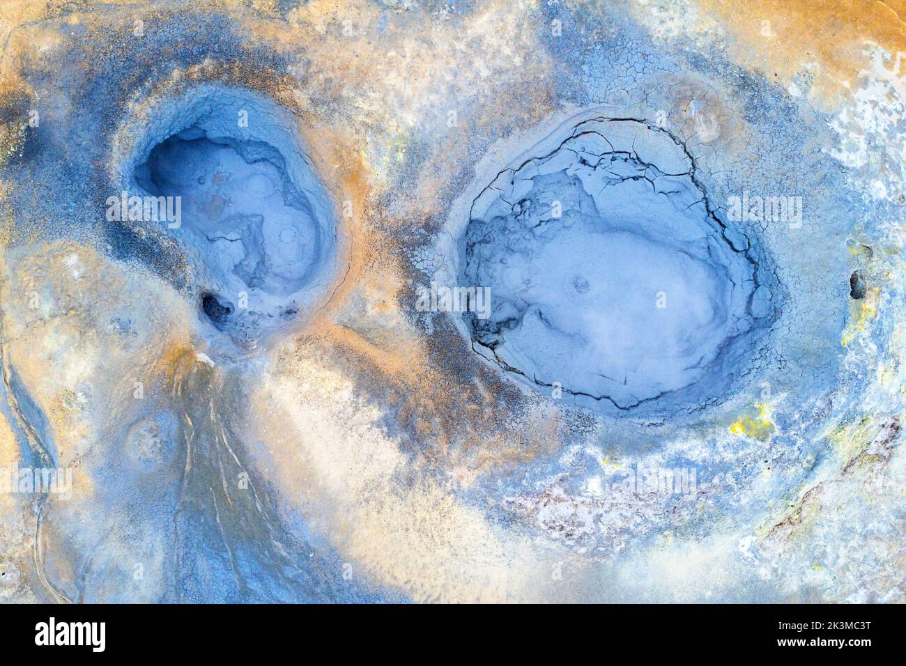 Aerial top view of blue mud bubbling in rough crater in Hverir ...