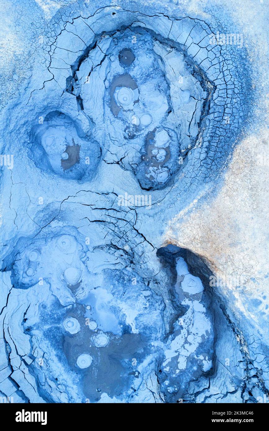Aerial top view of blue mud bubbling in rough crater in Hverir ...