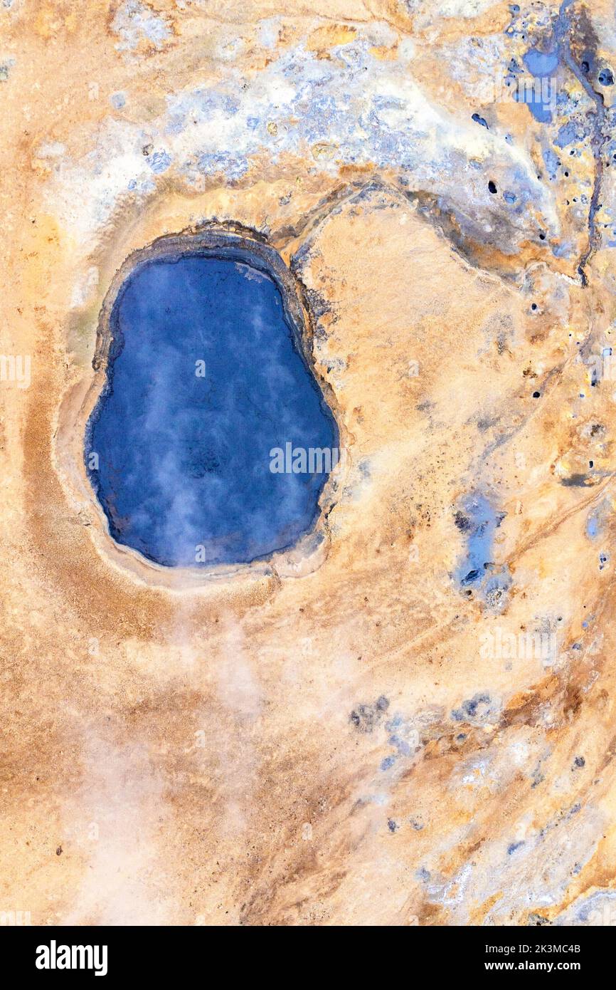 Aerial top view of blue mud bubbling in rough crater in Hverir ...