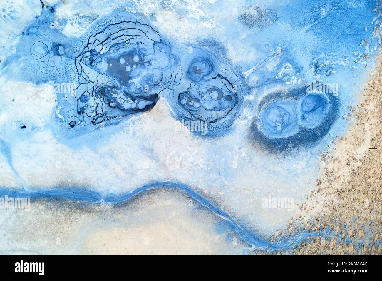Aerial top view of blue mud bubbling in rough crater in Hverir ...