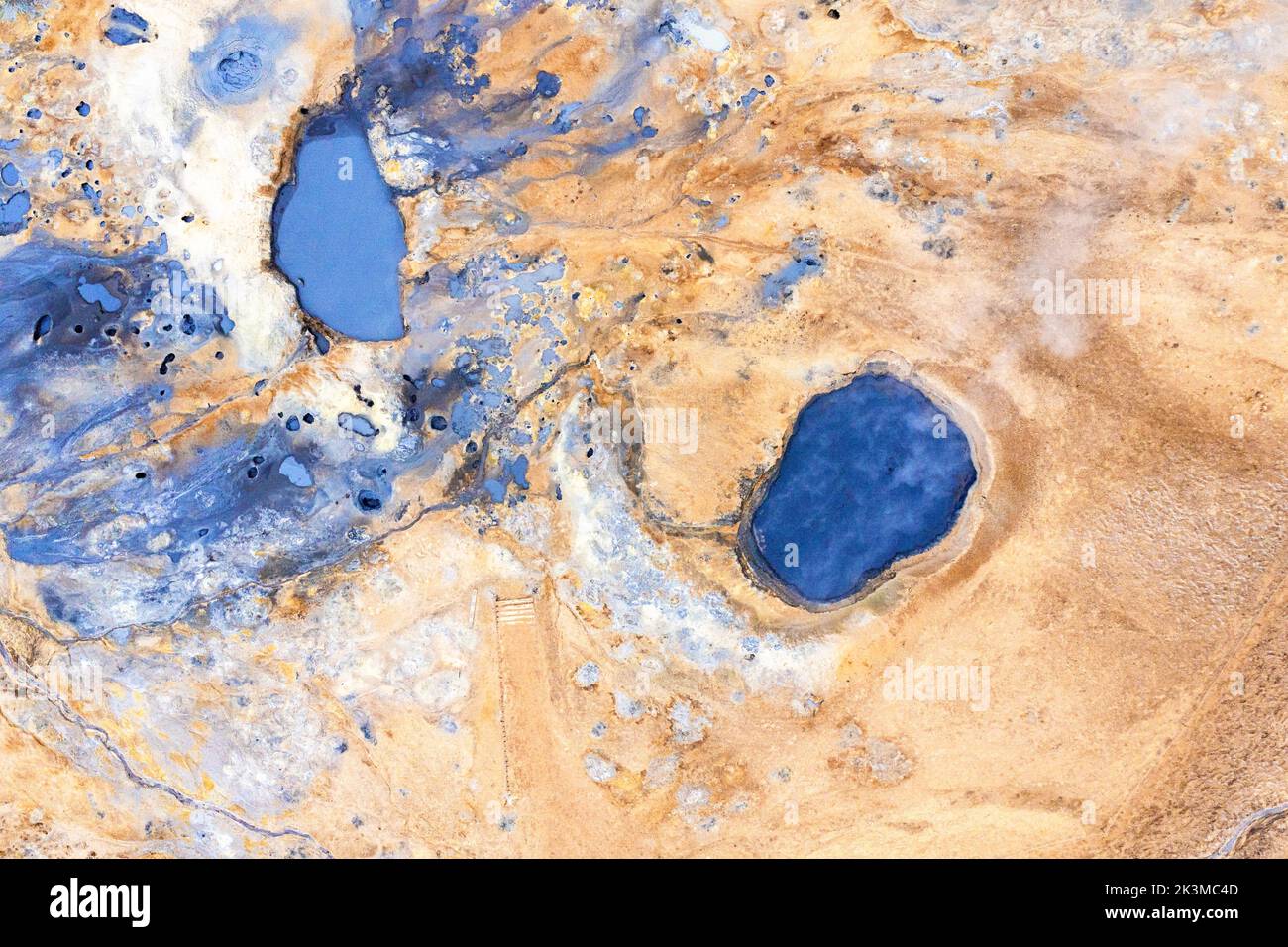 Aerial top view of blue mud bubbling in rough crater in Hverir ...