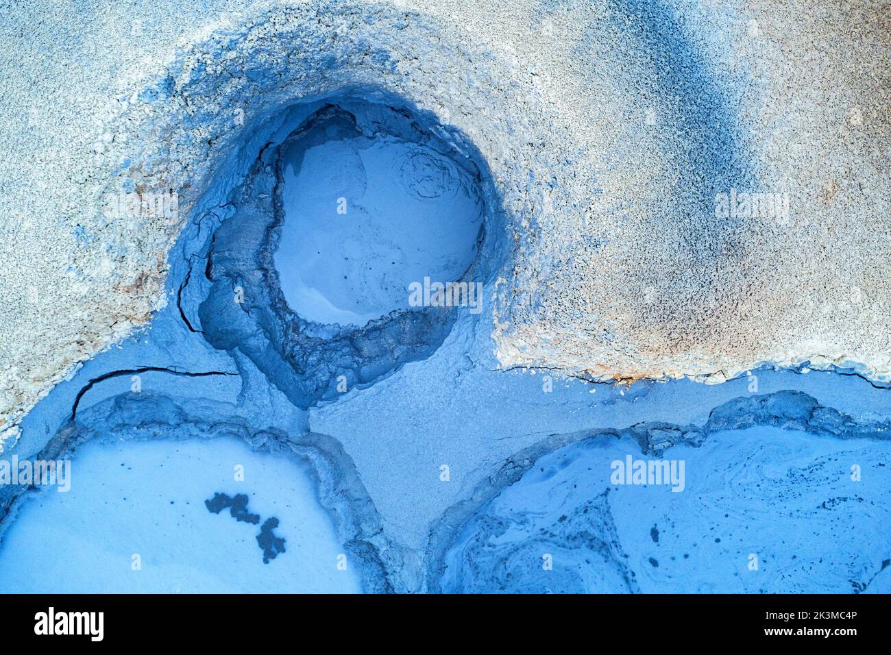 Aerial top view of blue mud bubbling in rough crater in Hverir ...