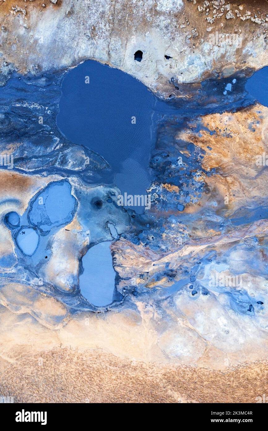 Aerial top view of blue mud bubbling in rough crater in Hverir ...