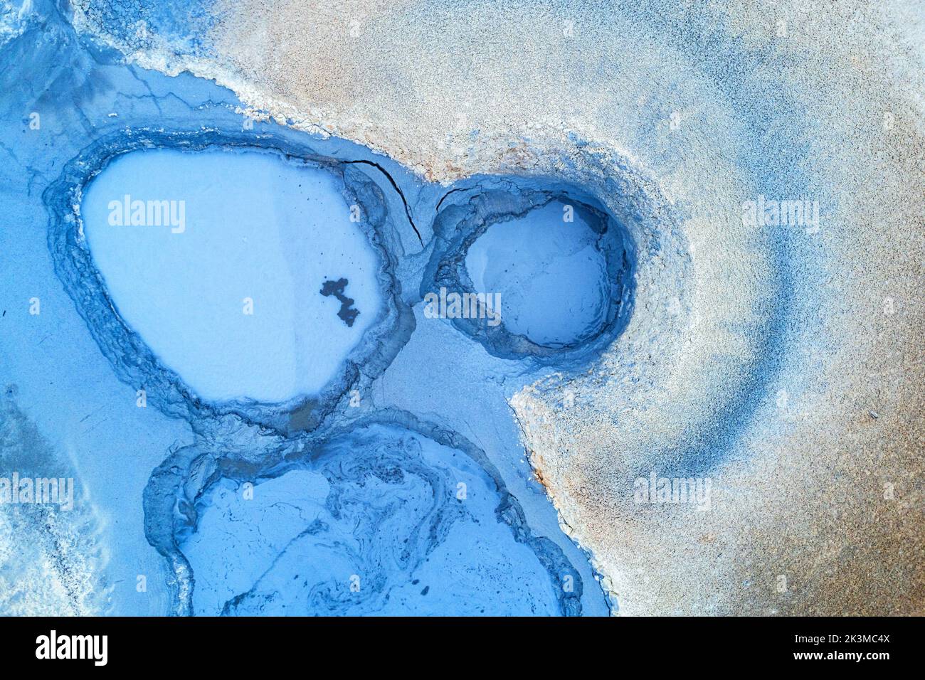 Aerial top view of blue mud bubbling in rough crater in Hverir ...