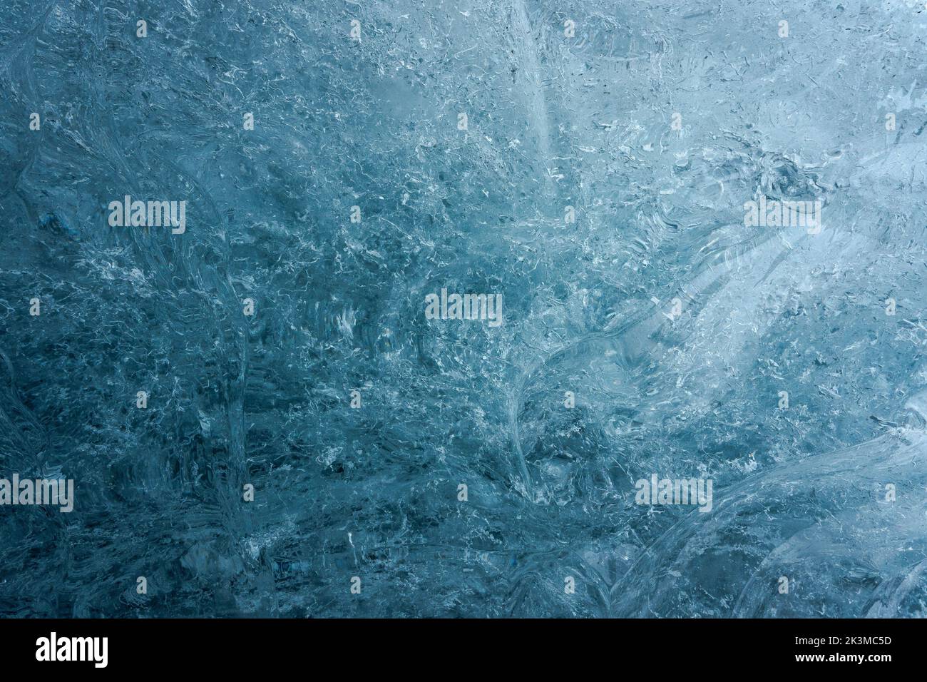 Clean blue water rippling near ice formations of glacier in Vatnajokull ...