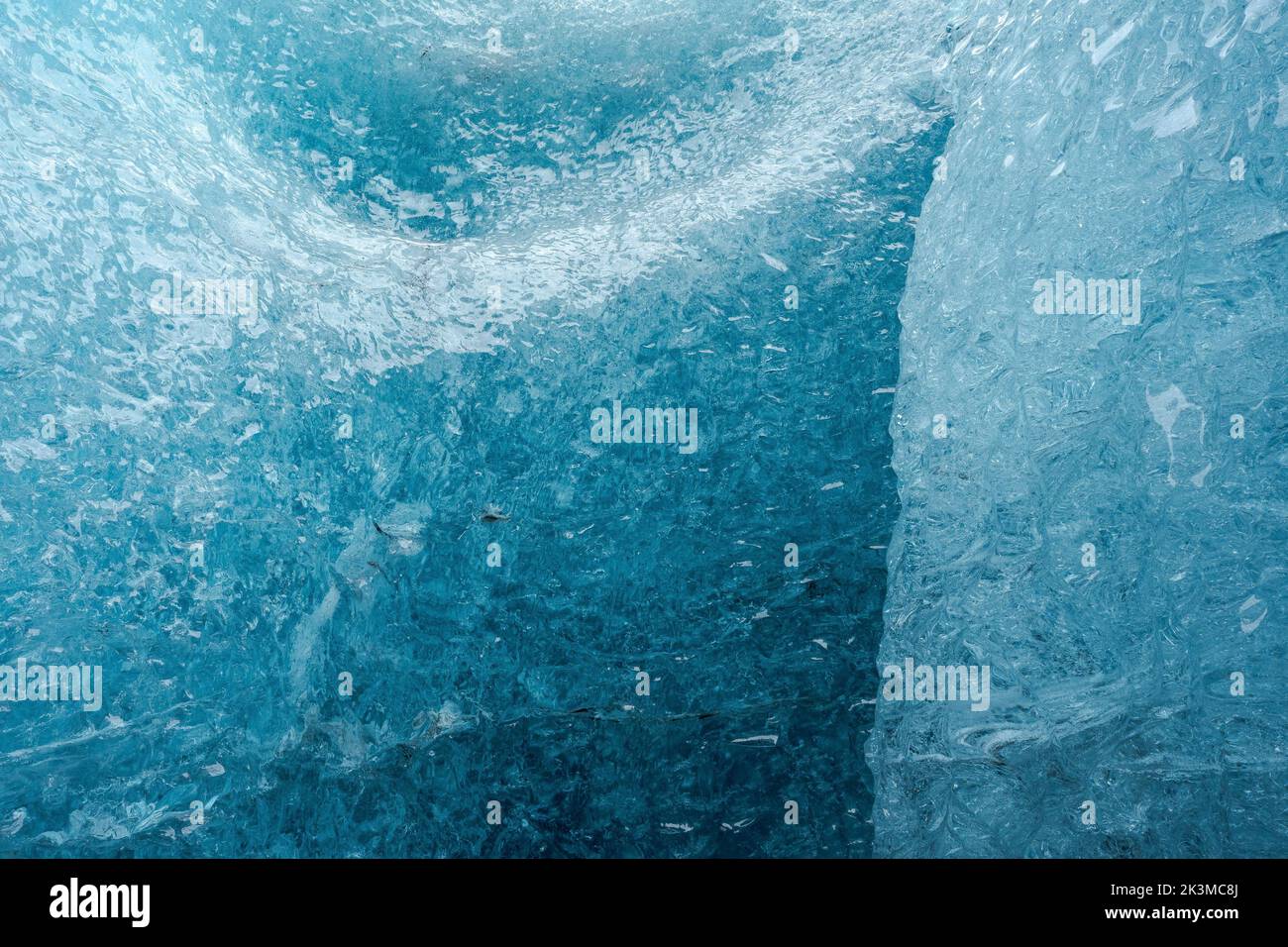 Clean blue water rippling near ice formations of glacier in Vatnajokull ...