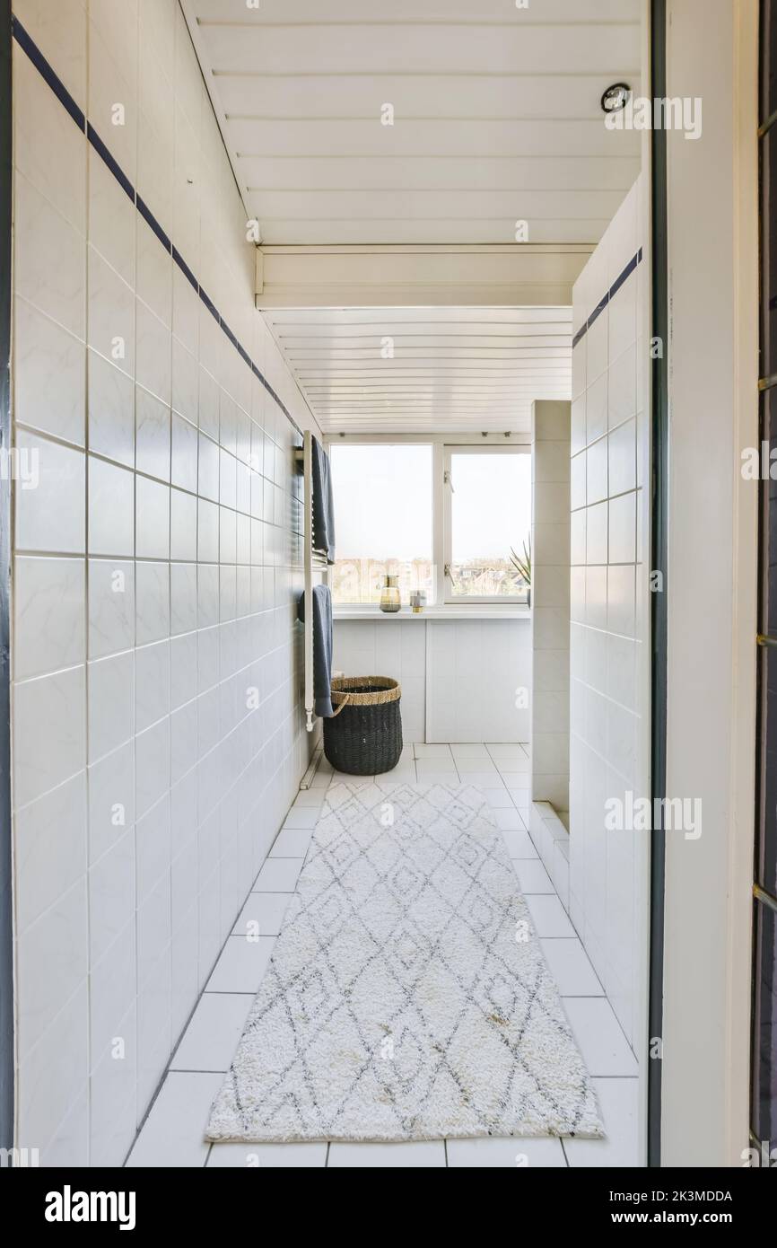Interior passage way with radiator on wall in modern house Stock Photo ...