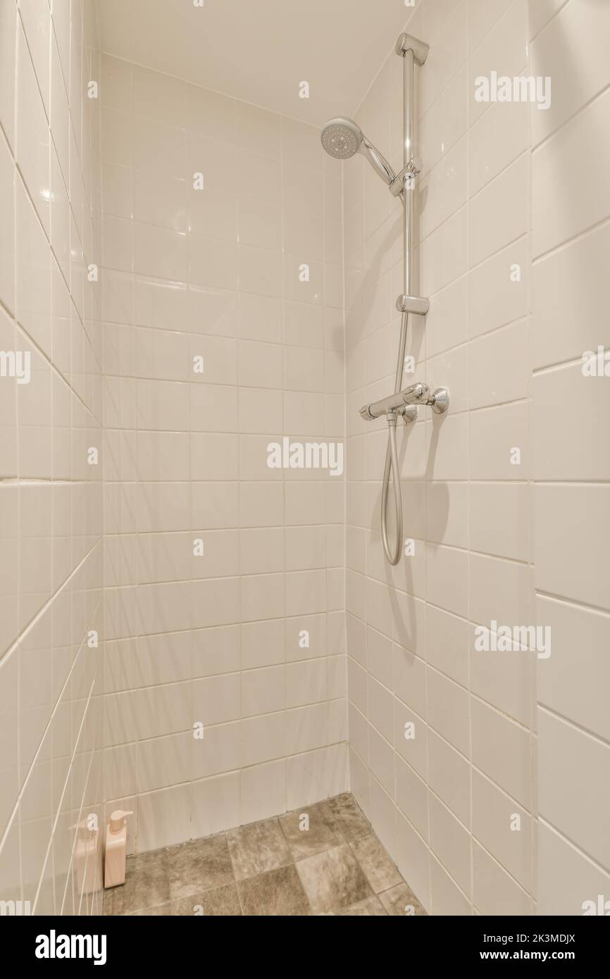 Interior of a modern shower with white walls Stock Photo - Alamy