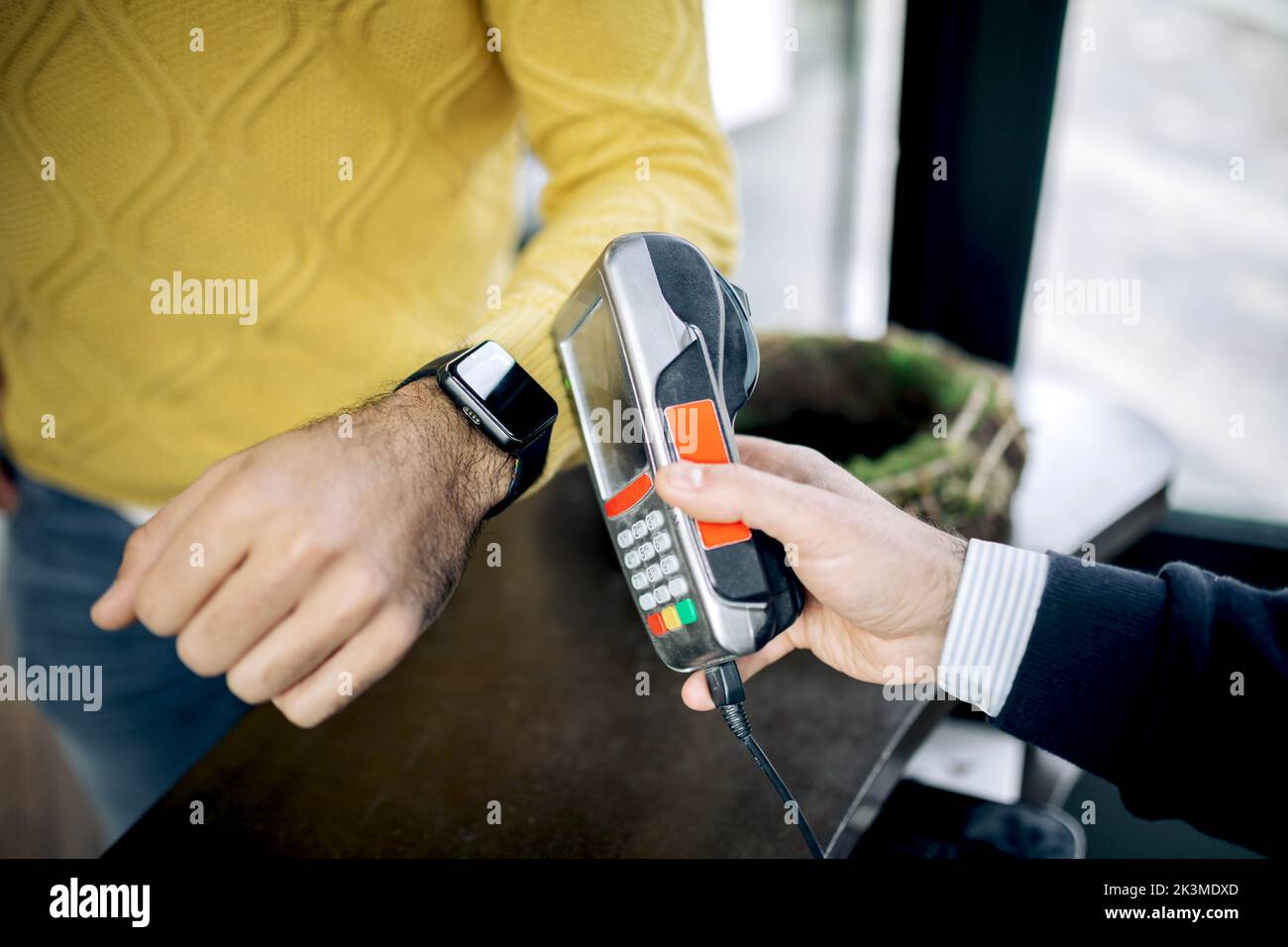From above of crop male customer making cashless payment with smart ...