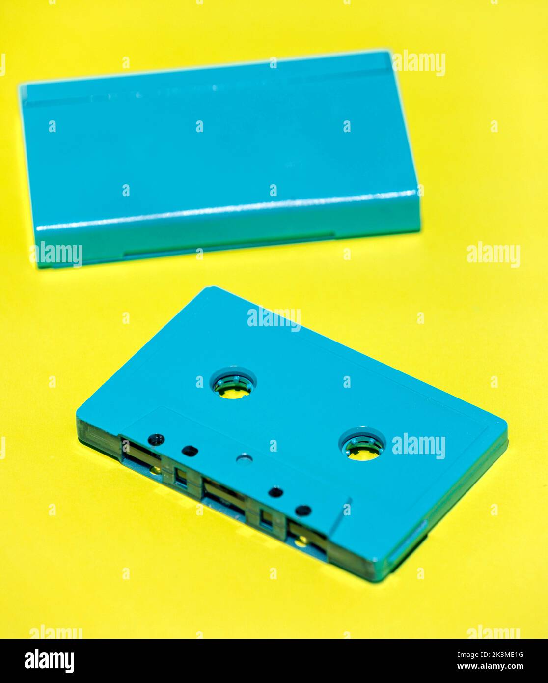 High angle of isolated vintage blue audio cassette and case placed on ...
