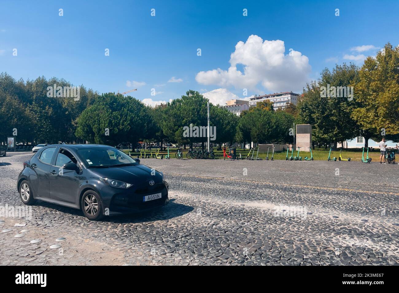 Car driving on city road hi-res stock photography and images - Alamy