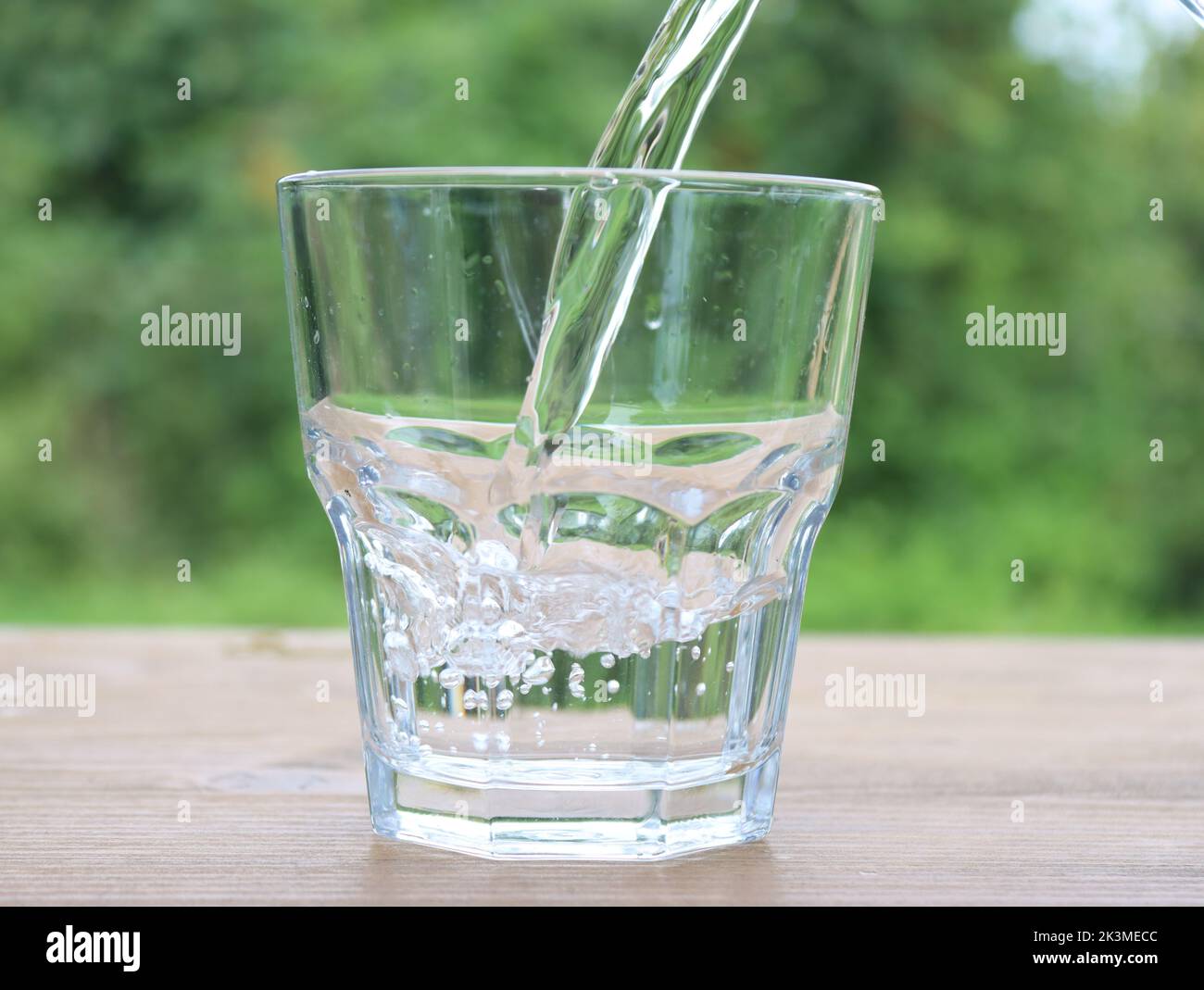 A transparent glass cup being filled with water, close-up Stock Photo ...