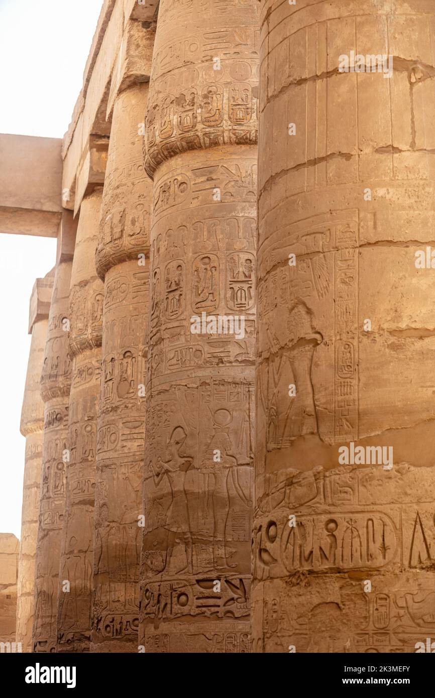 Different hieroglyphs on the walls and columns in the Karnak temple. Karnak temple is the ...