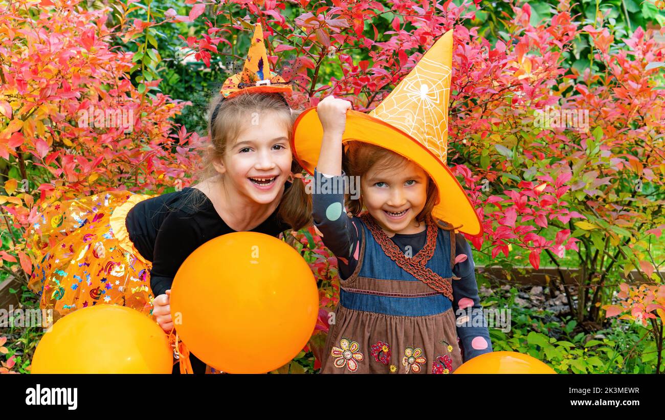 Children in Halloween costumes laugh close-up. Positive emotions of ...