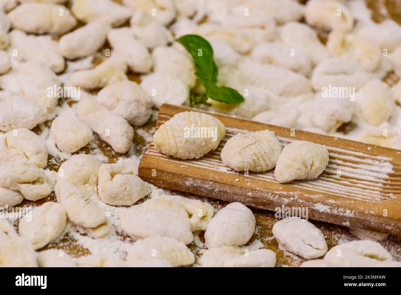 Preparation of gnocchi, on the table. Traditional Italian food Stock ...