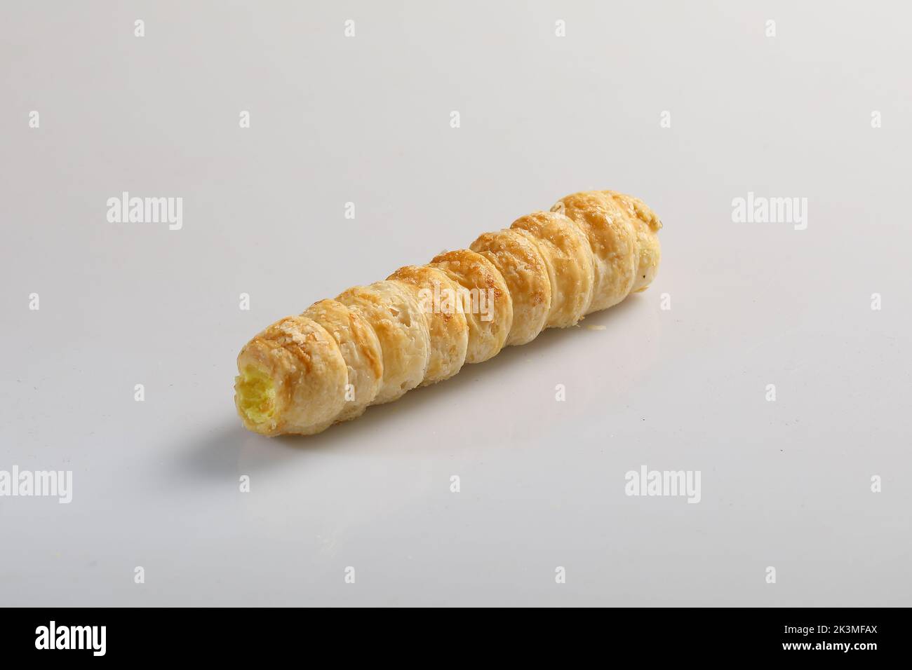 puff pastry creme roll with cream on white board Stock Photo - Alamy