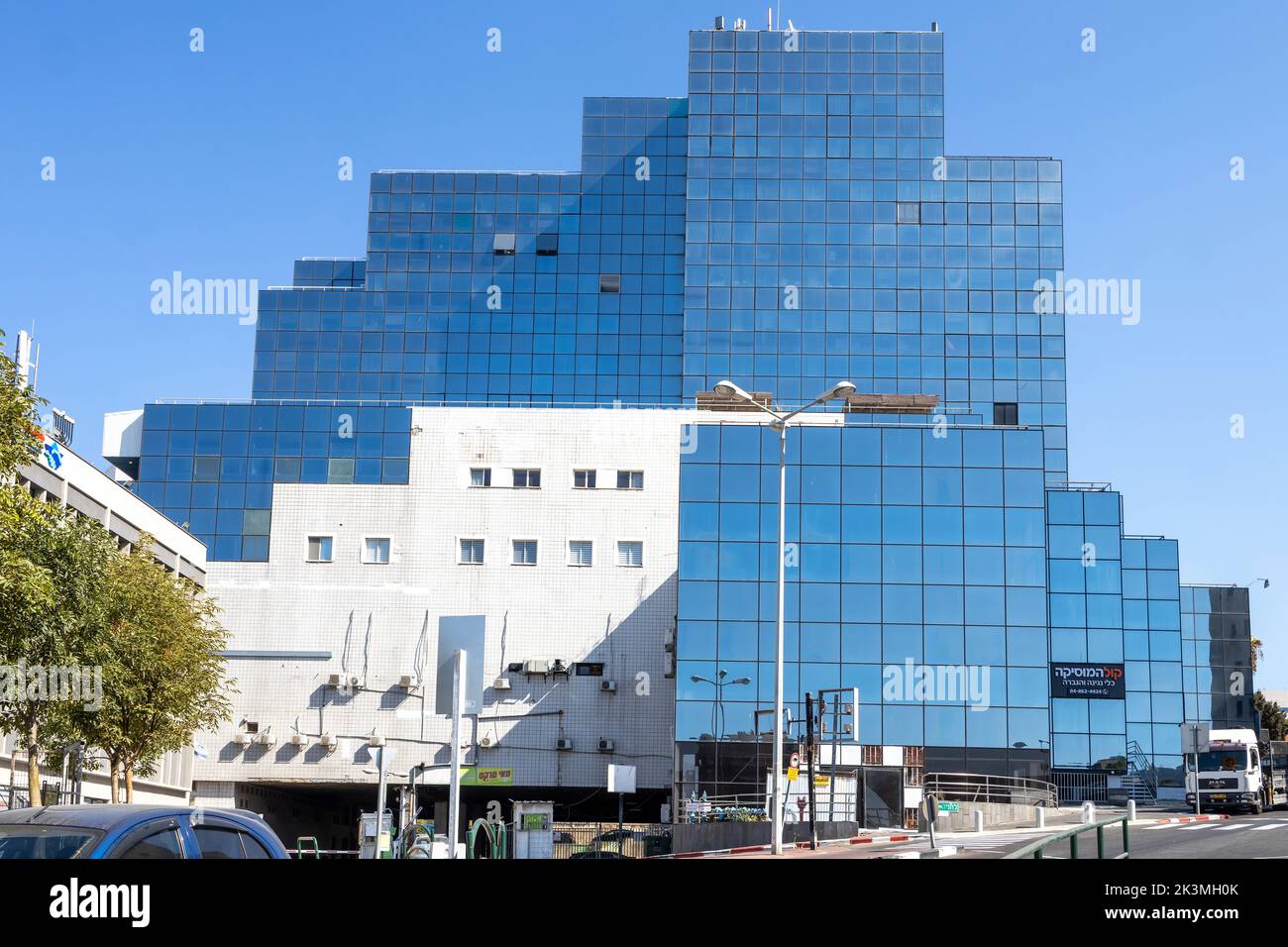 Haifa, Israel - September 2022, high-rise building with "black shekem ...