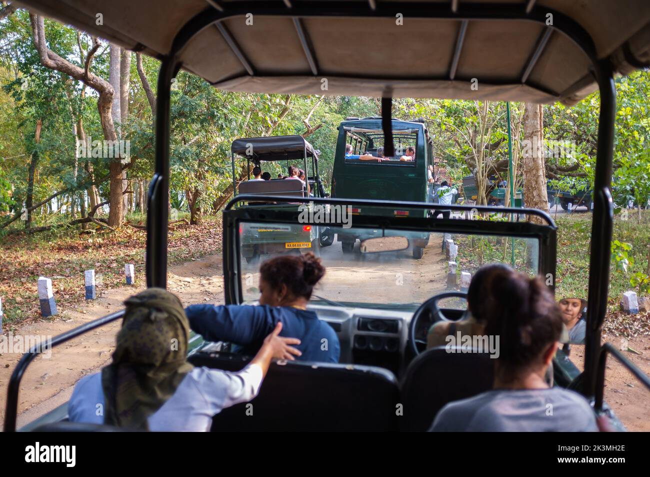 A group of tourists in shuttle vehicles touring the Rajiv Gandhi ...
