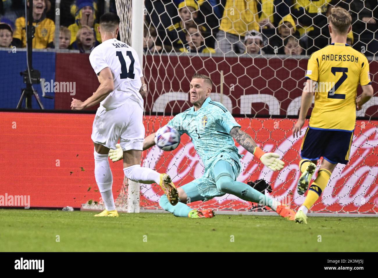 Sweden's goalkeeper Robin Olsen rescues a shot from Slovenia's Benjamin ...