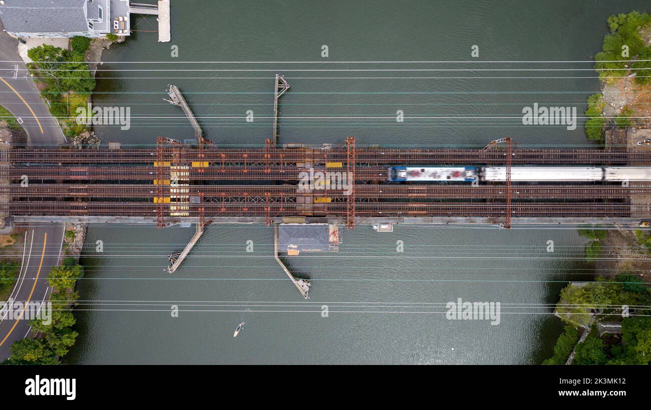 An aerial shot of a train on a railroad bridge Stock Photo - Alamy