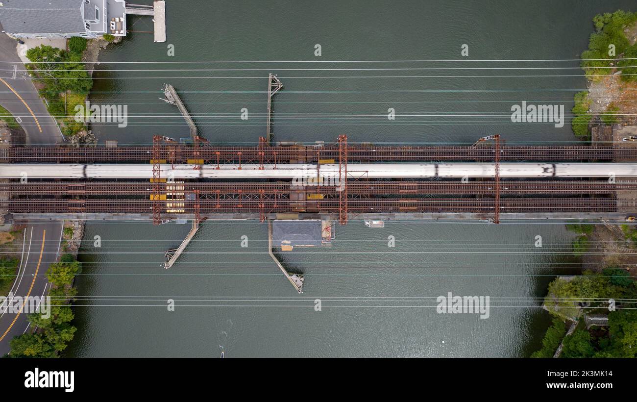 An aerial shot of a train on a railroad bridge Stock Photo - Alamy