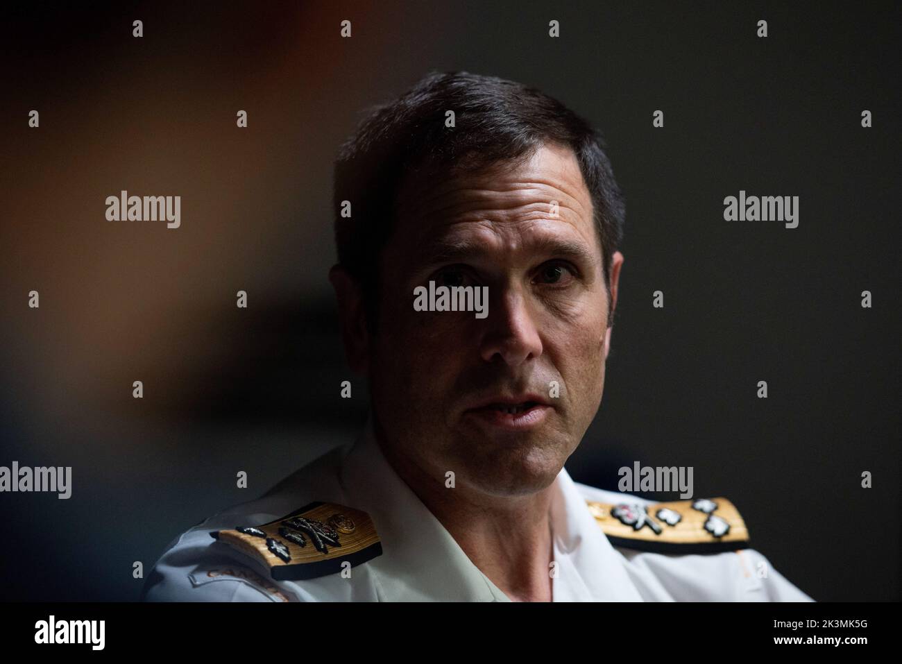 Vice-Admiral Angus Topshee speaks with a reporter during an interview ...
