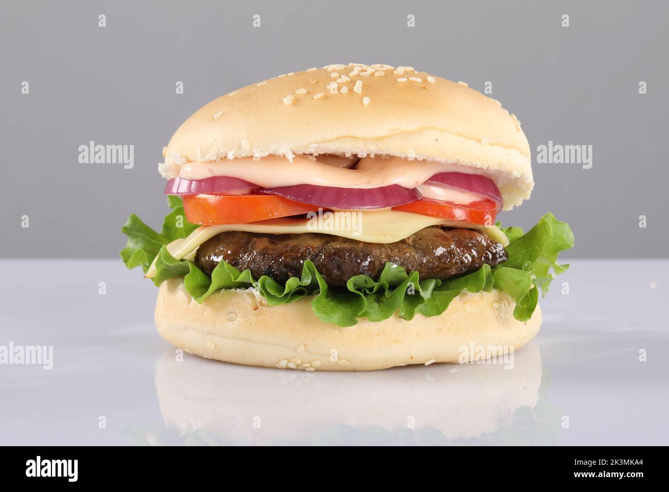 CRISPY CHEESY CHICKEN PATTY BURGER ON WHITE background Stock Photo - Alamy