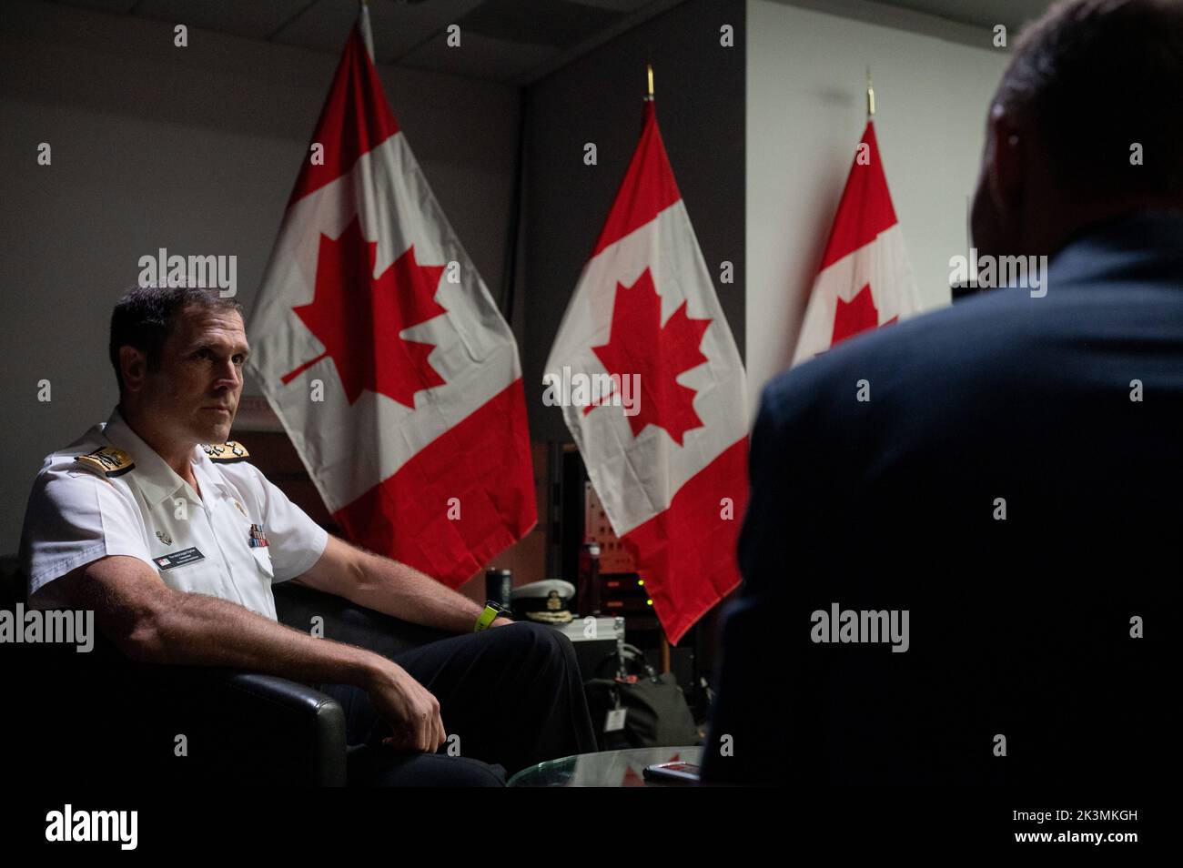 Vice-Admiral Angus Topshee speaks with a reporter during an interview ...