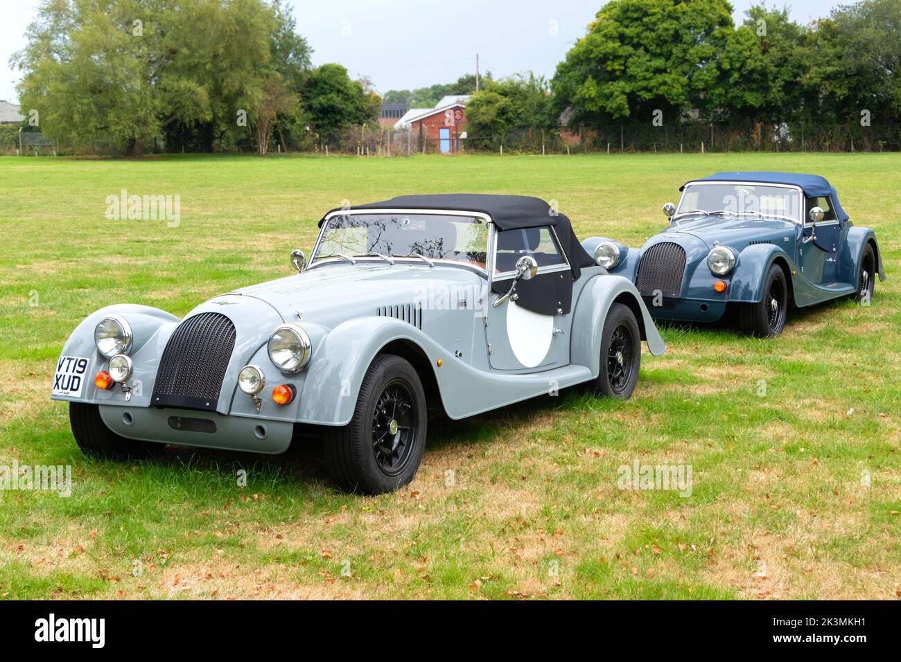 new convertible classic blue and gray morgans parked in field at the ...