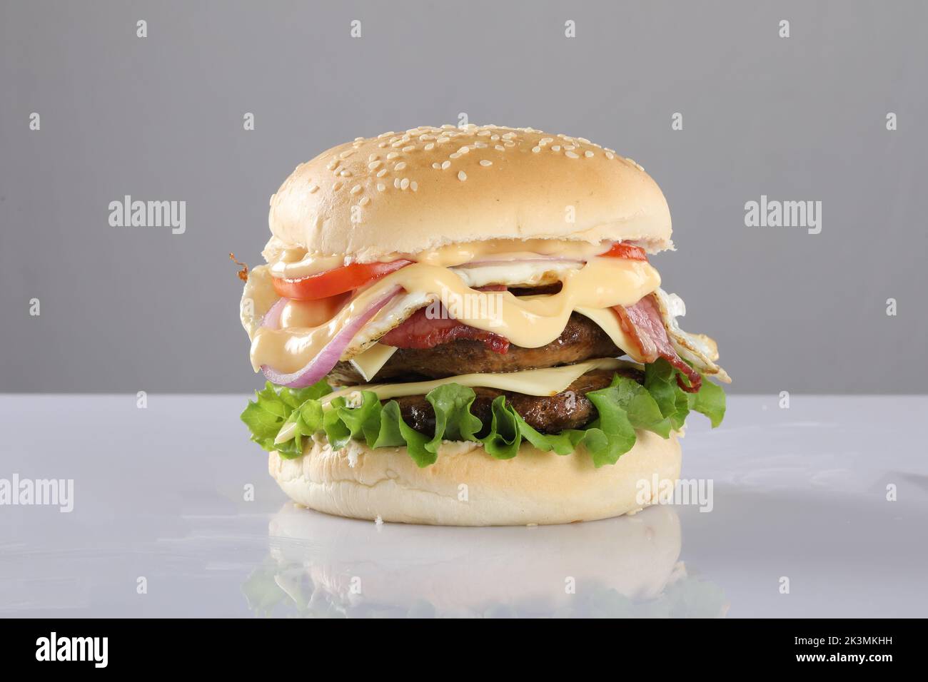 CRISPY CHEESY CHICKEN PATTY BURGER ON WHITE background Stock Photo - Alamy