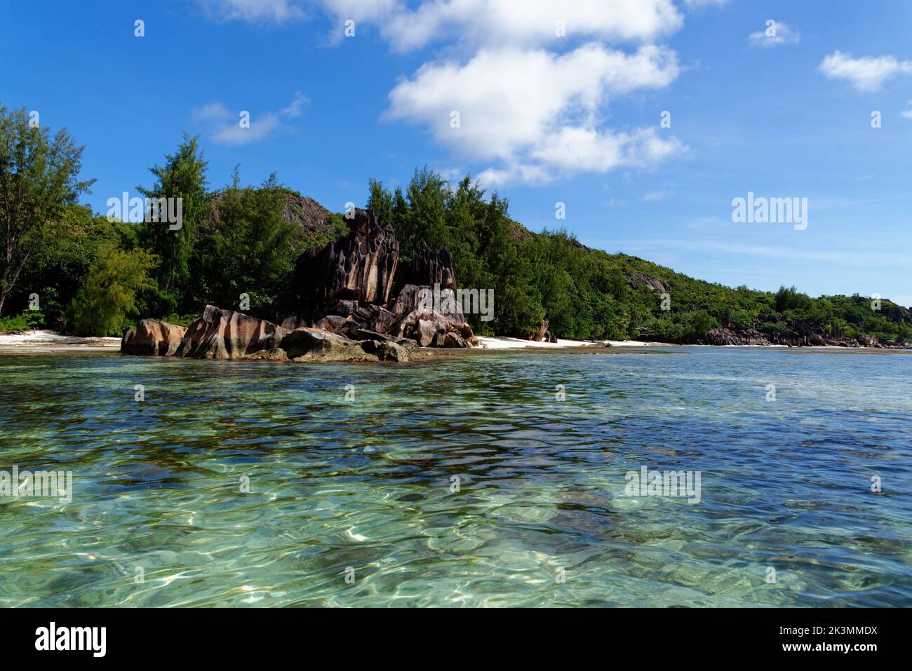 Beach on Curieuse Island, Seychelles, with lava stone rocks and lush ...