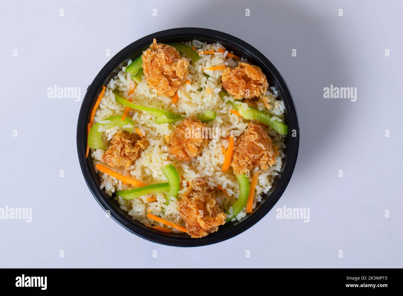 Schezwan Chicken Fried Rice in white bowl isolated on white background ...