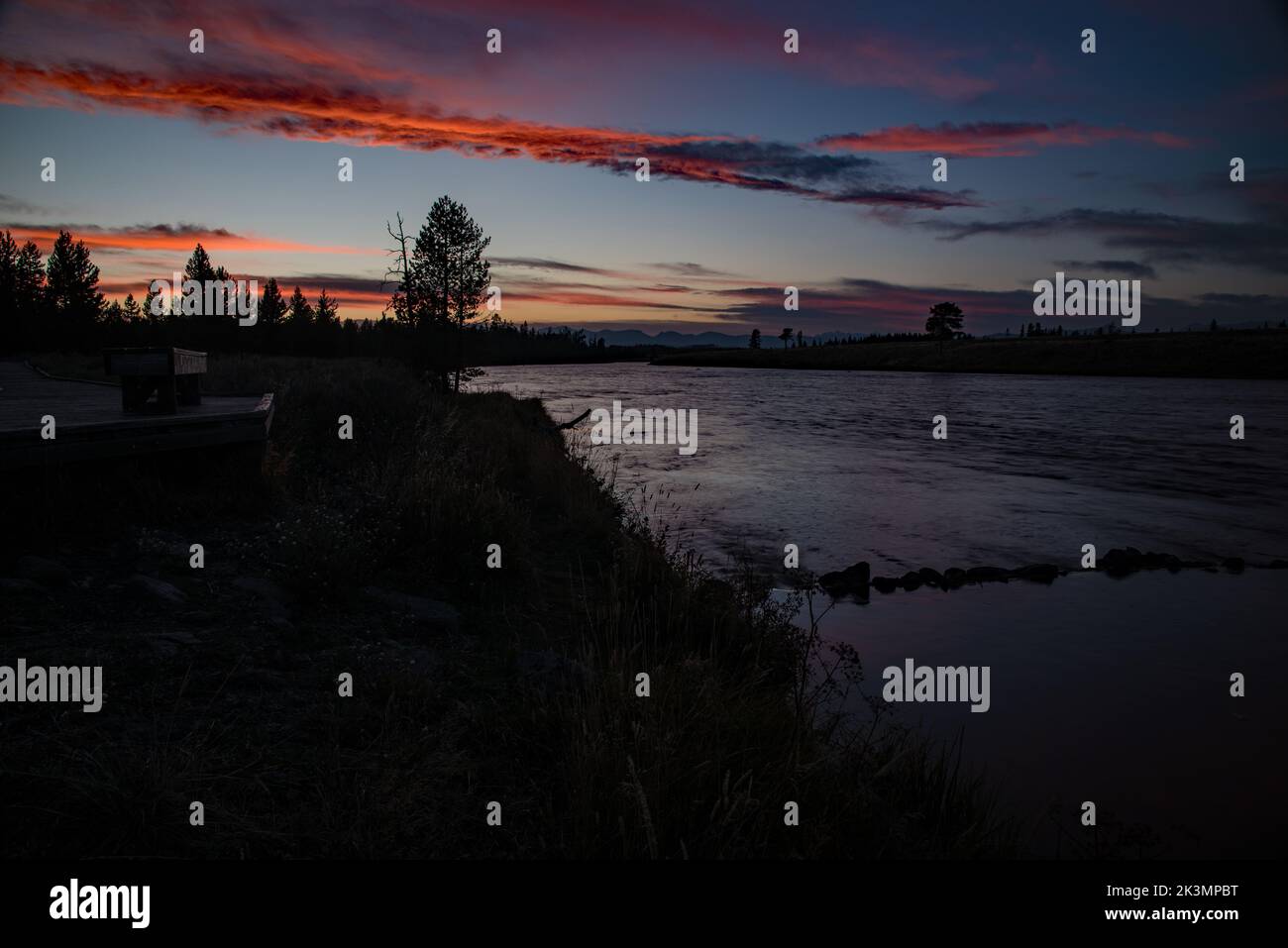 Sunset along the Madison River looking west toward West Yellowstone ...